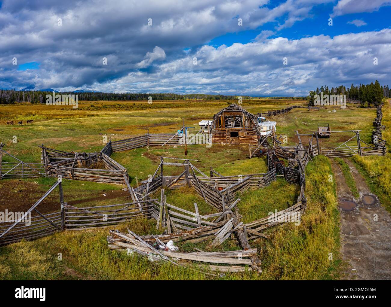 Abandoned and decayed old wooden barn, farm facilities and buildings in ...
