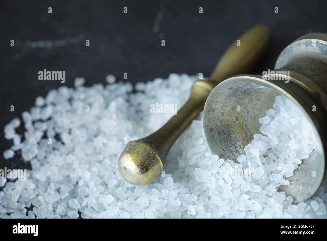 Large sea salt. Spice. Mortar and pestle for grinding salt Stock Photo ...