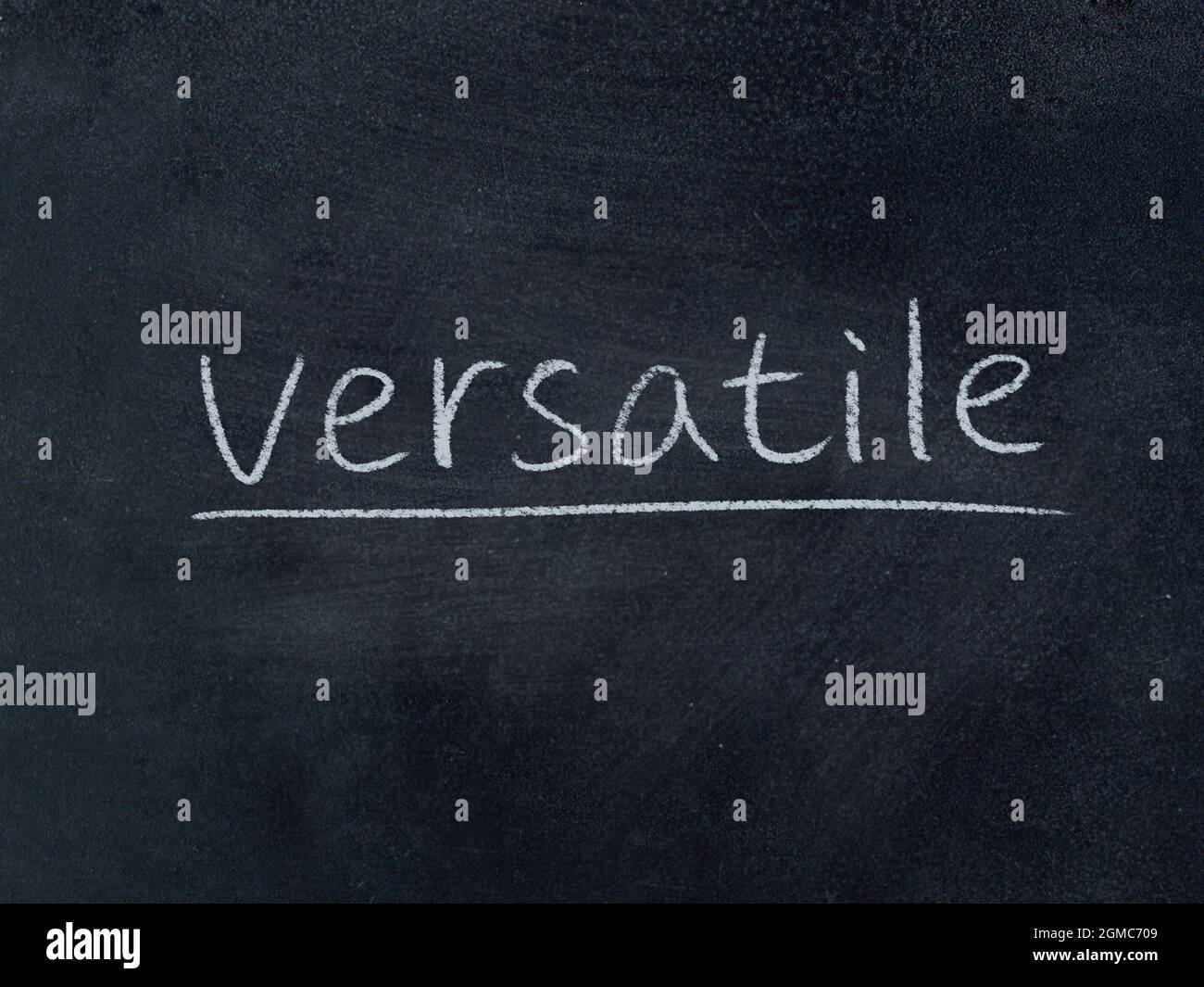 versatile concept word on blackboard background Stock Photo - Alamy