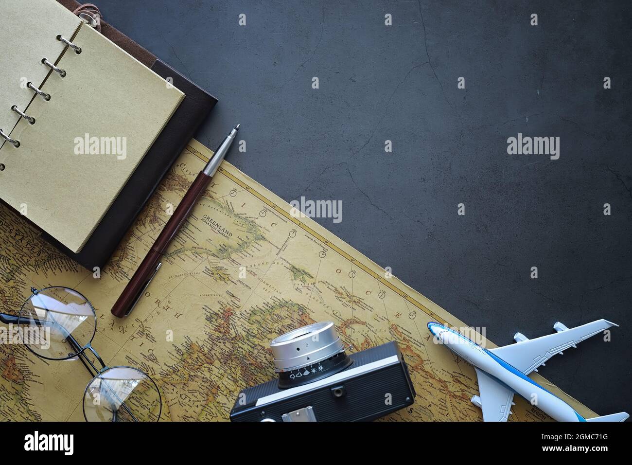 Travel concept. Map on the table and model aircraft Stock Photo - Alamy