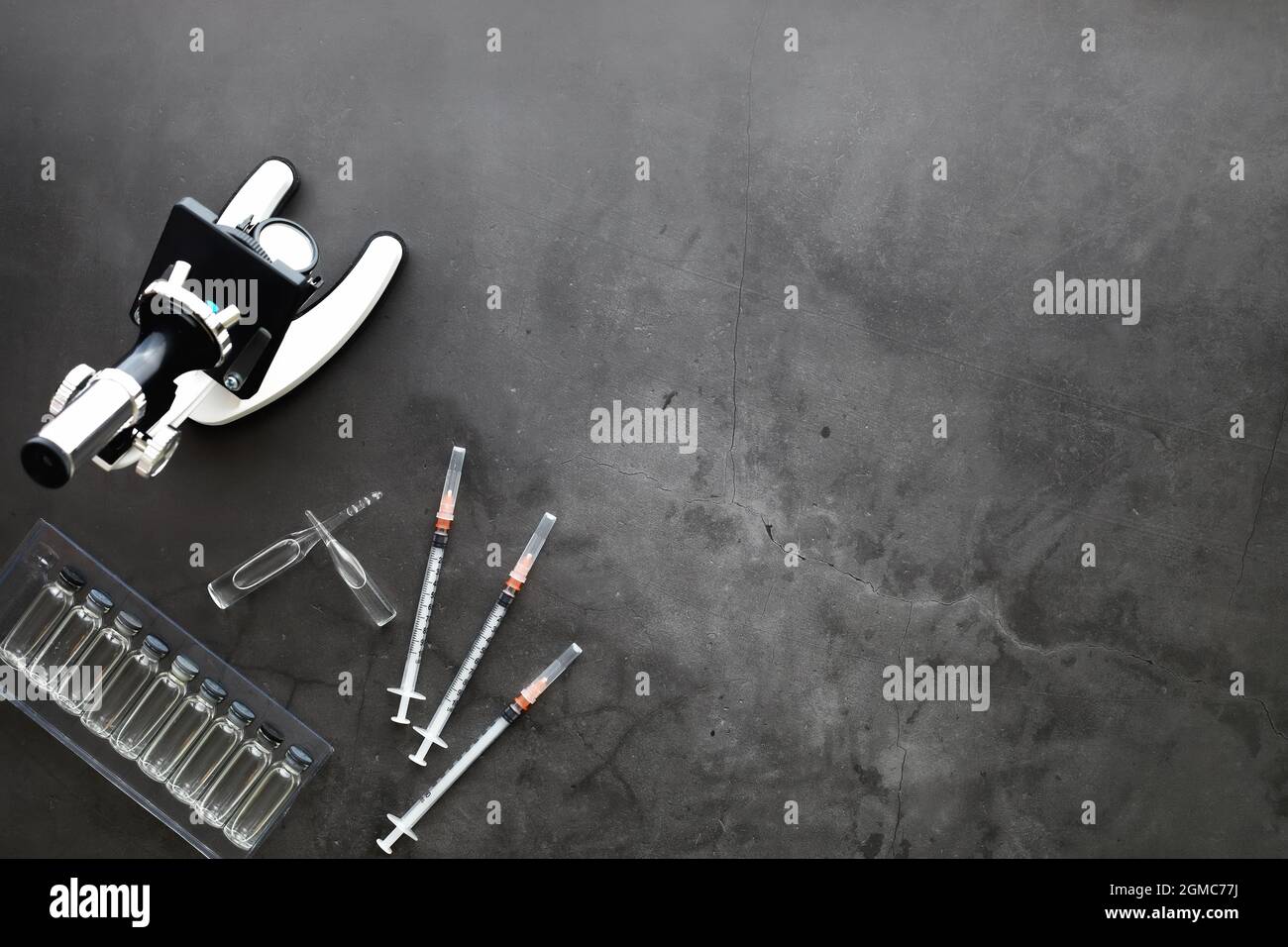 Vaccination. Disposable syringes and test tubes with medicinal vaccines ...