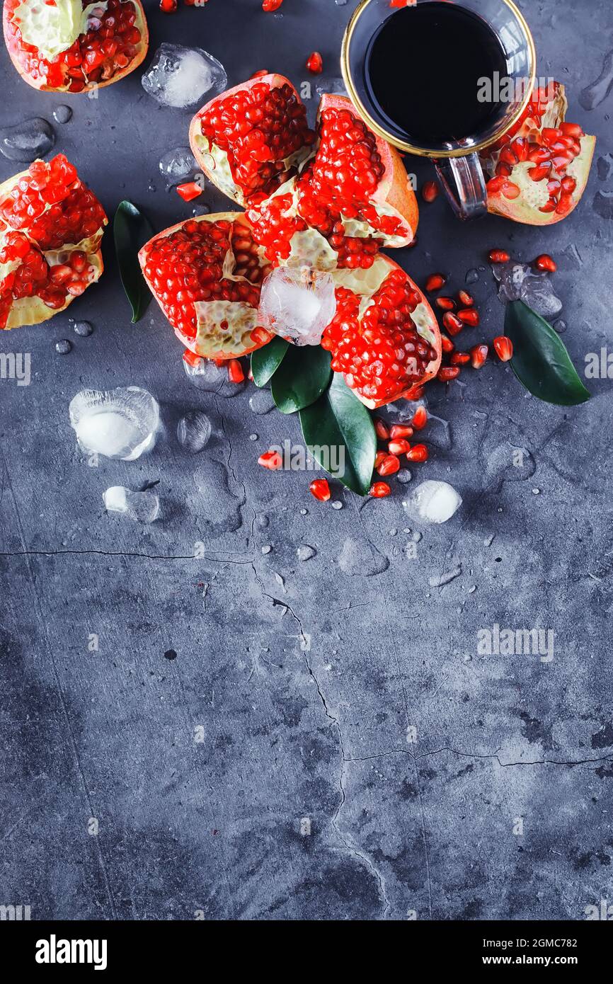 Ripe red pomegranate. Ripe grains of pomegranate on the table ...