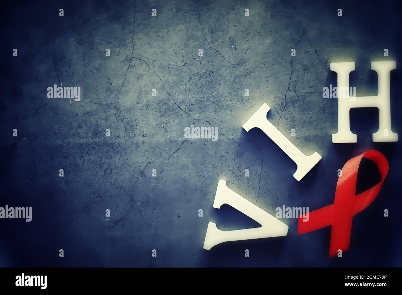 Symbol of human immunodeficiency virus disease. Red ribbon. A helping ...