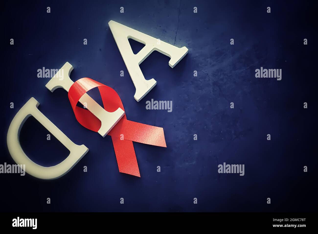 Symbol of human immunodeficiency virus disease. Red ribbon. A helping ...