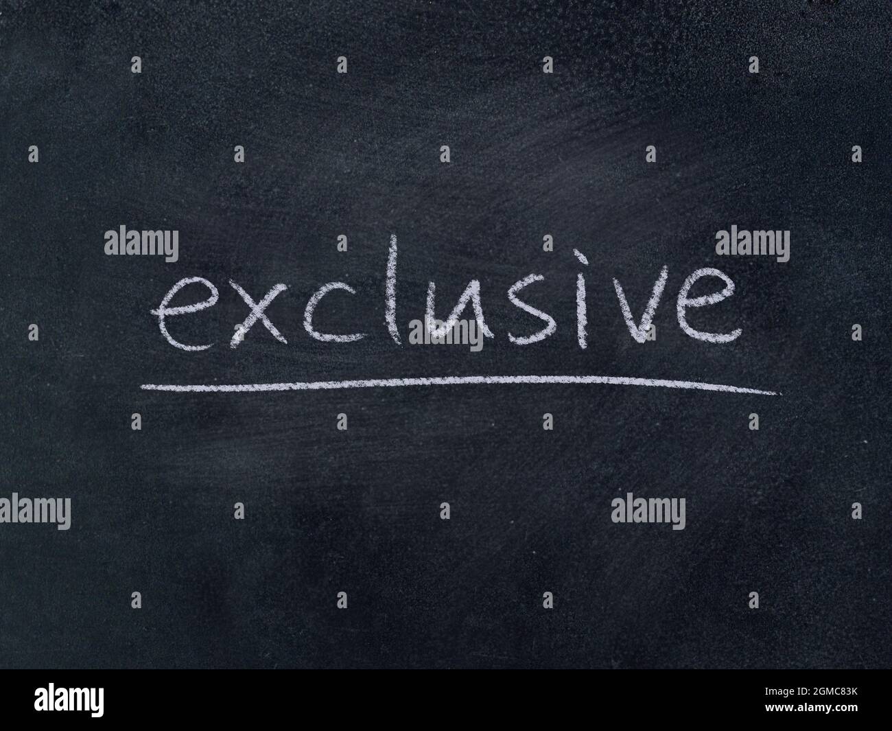 exclusive concept word on blackboard background Stock Photo - Alamy