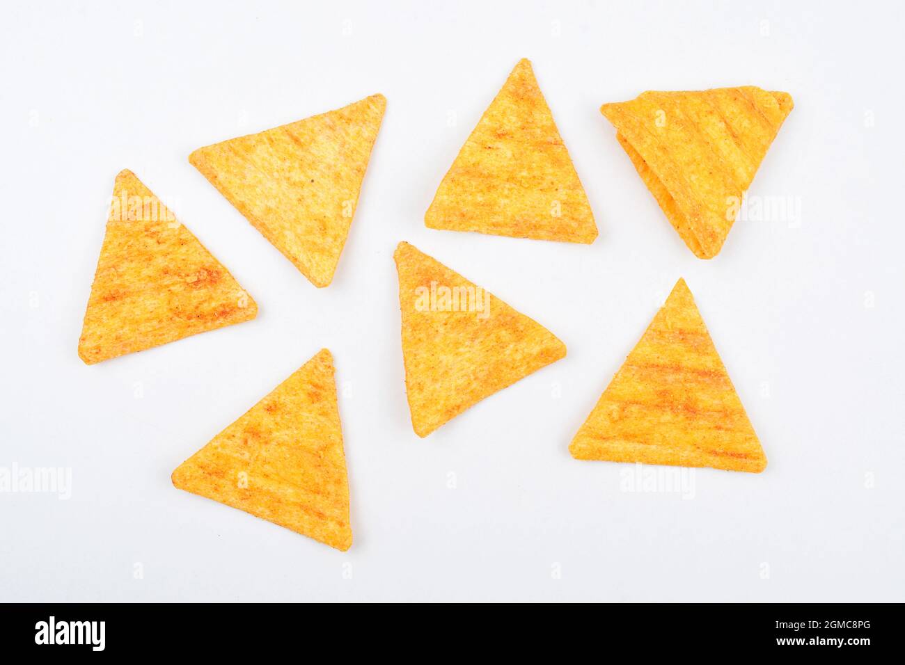 Top view of triangle chips on white background Stock Photo - Alamy