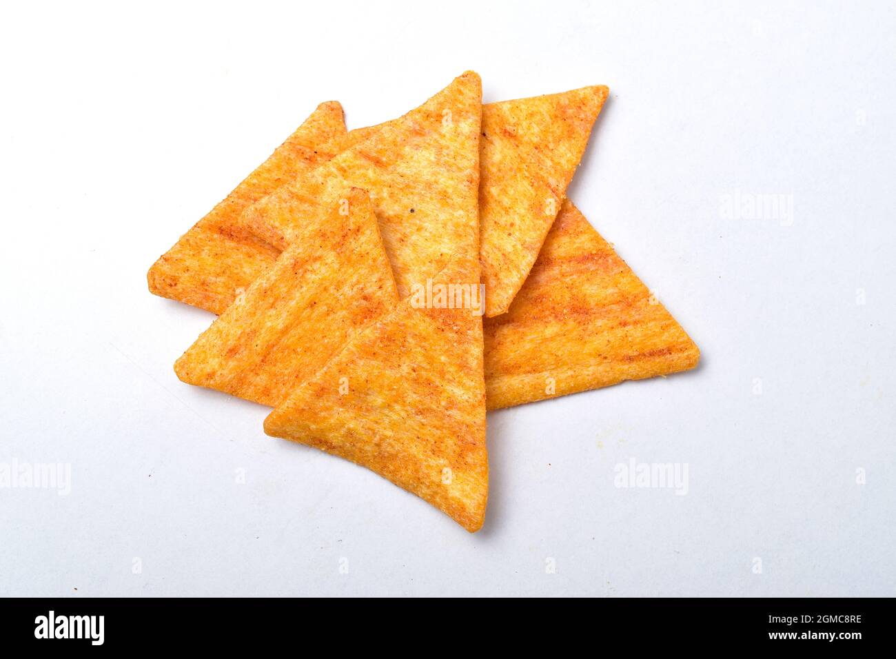 Closeup of triangle chips isolated on white background Stock Photo - Alamy