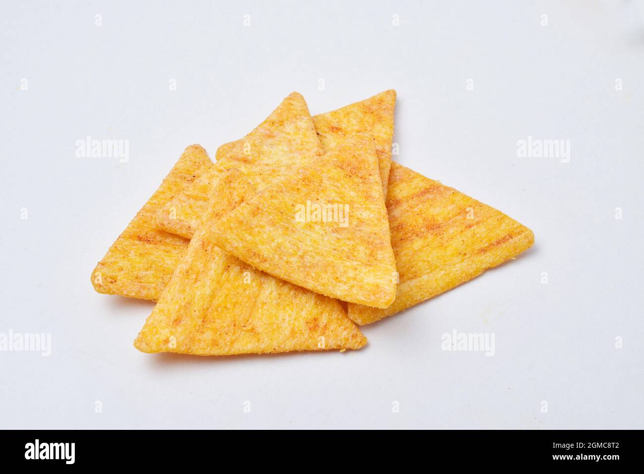 triangle corn chips isolated on white background Stock Photo - Alamy