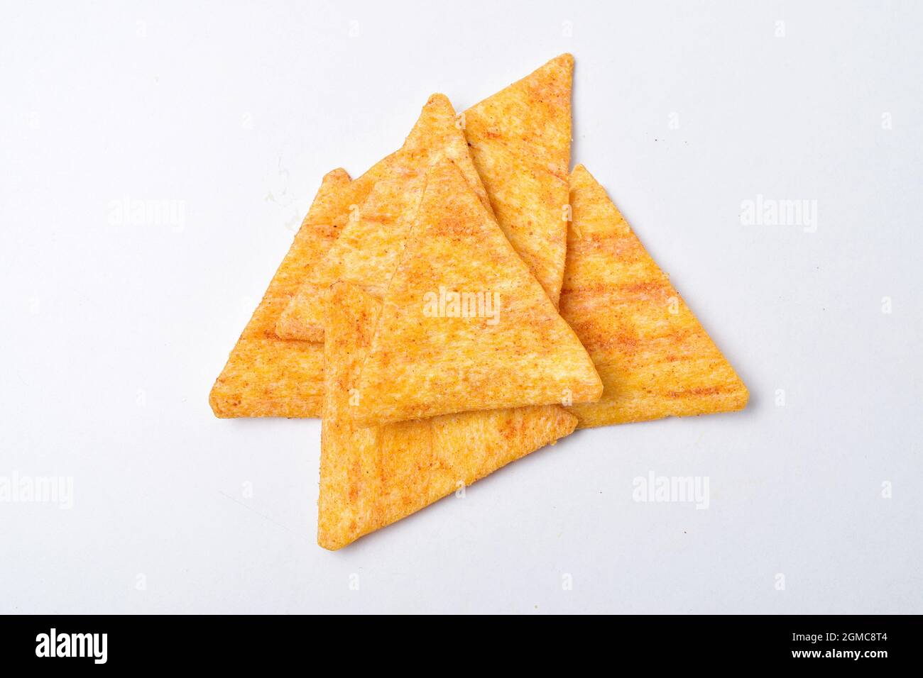 triangle corn chips isolated on white background Stock Photo - Alamy