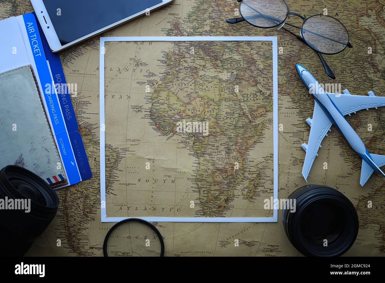 Travel concept. Map on the table and model aircraft Stock Photo - Alamy