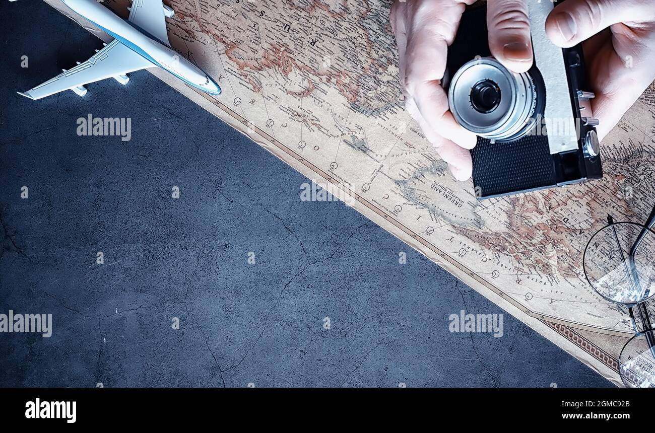 Travel concept. Map on the table and model aircraft Stock Photo - Alamy