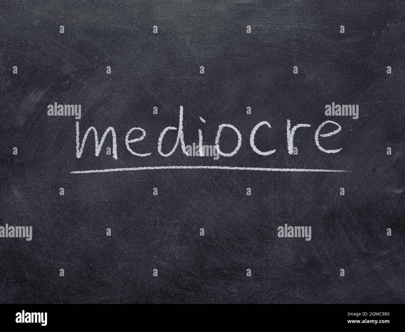 mediocre concept word on blackboard background Stock Photo - Alamy