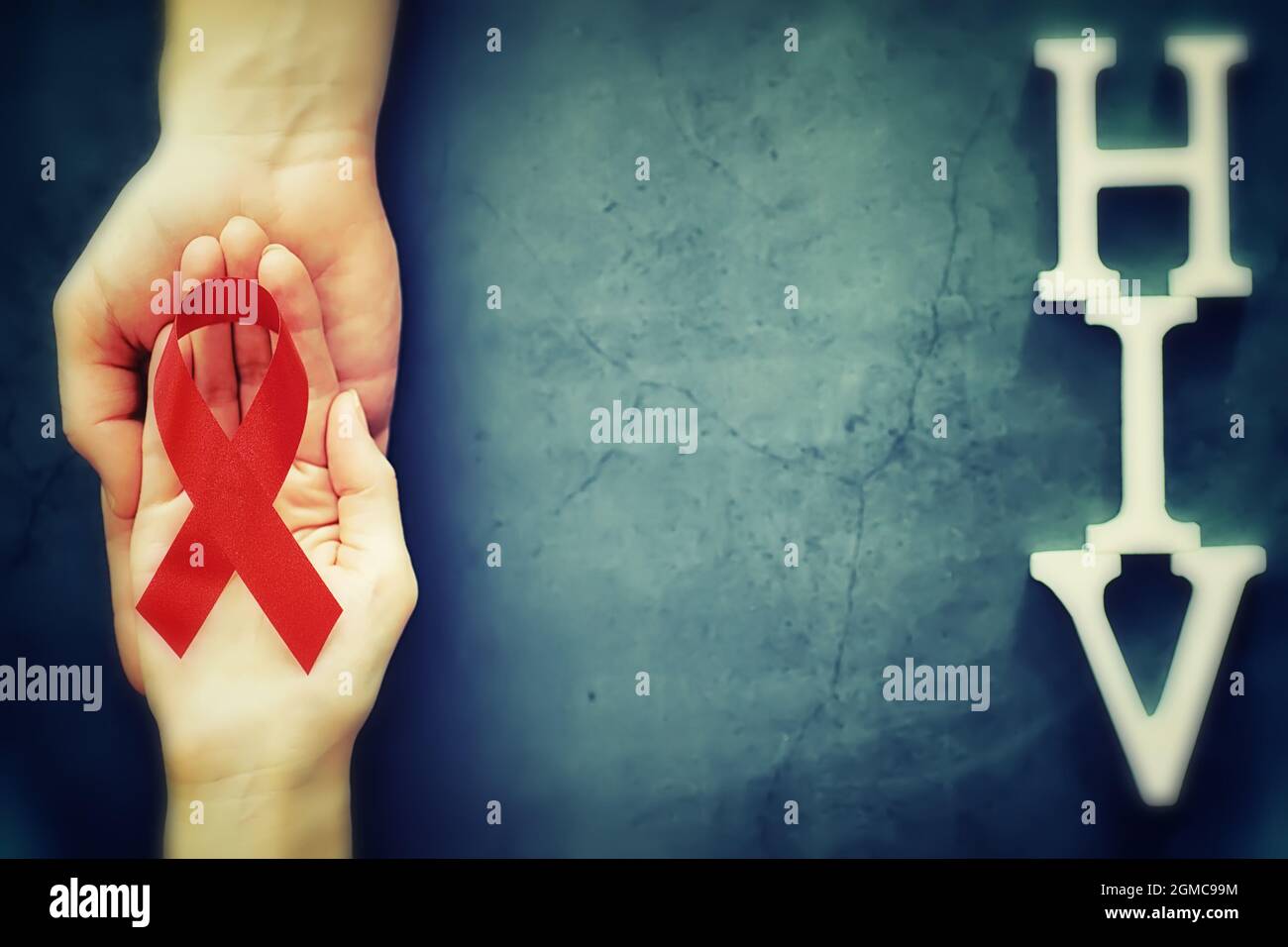 Symbol of human immunodeficiency virus disease. Red ribbon. A helping ...