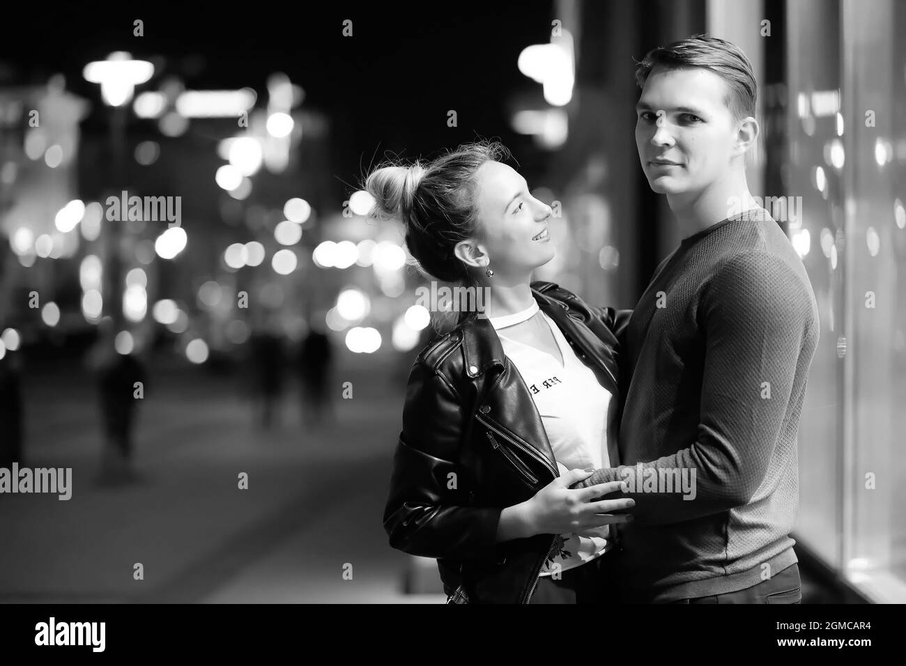Beautiful couple on a date in a night city outdoor Stock Photo - Alamy
