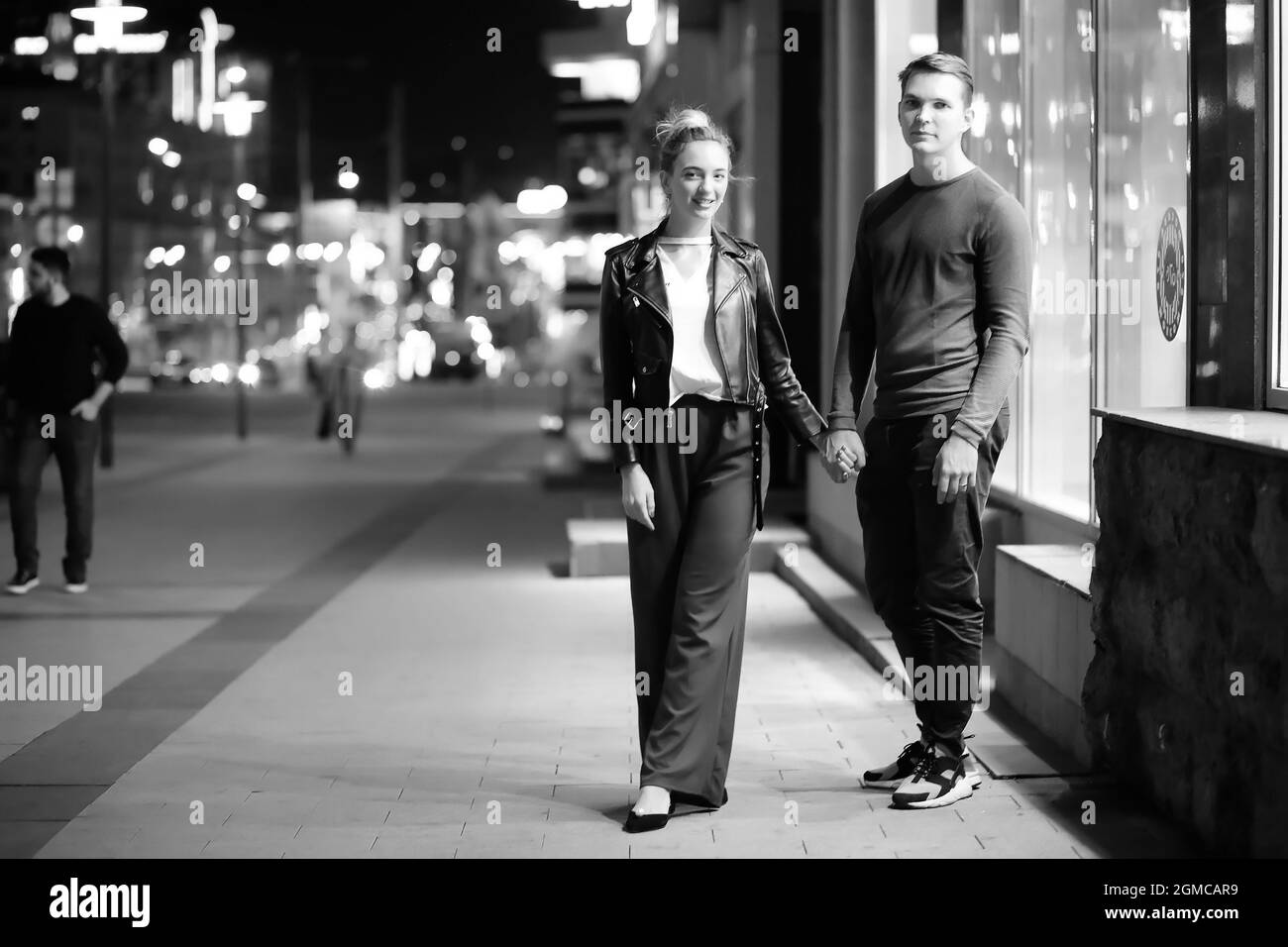 Beautiful couple on a date in a night city outdoor Stock Photo - Alamy