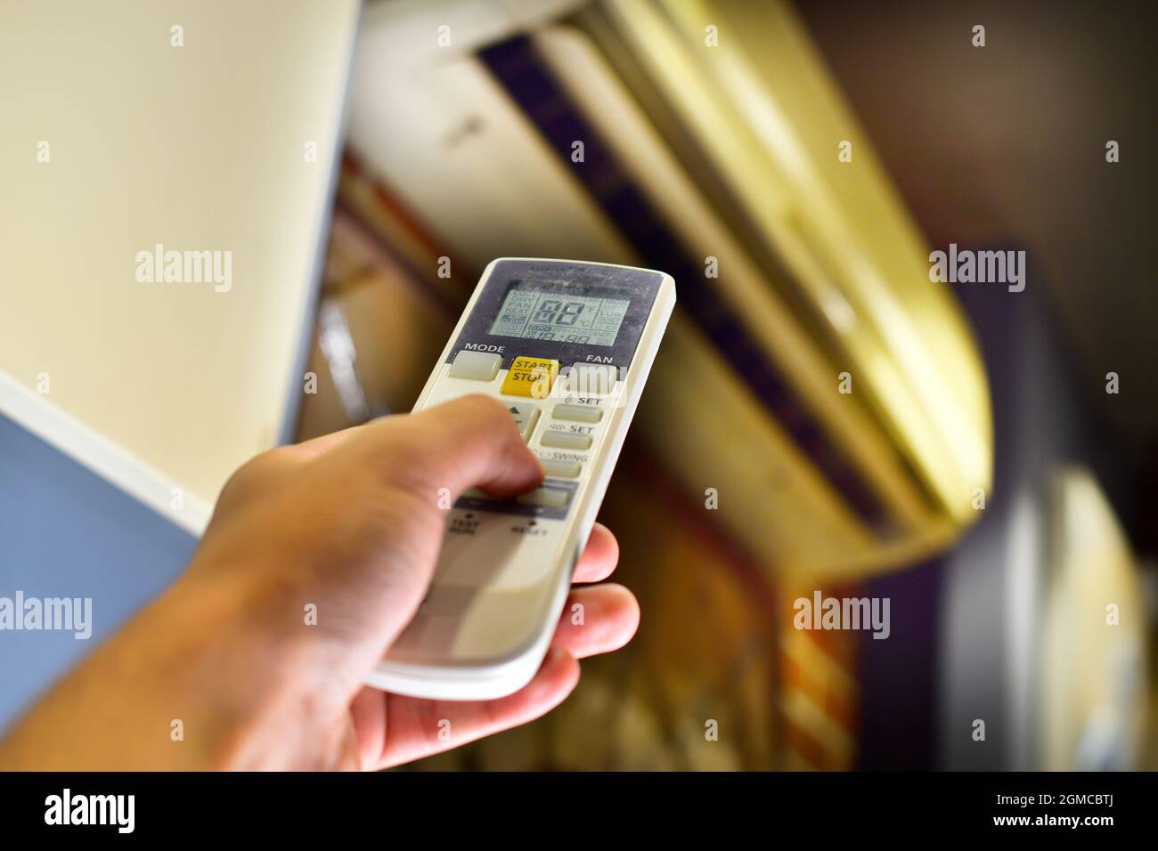 Hand remote air conditioner hi-res stock photography and images - Alamy