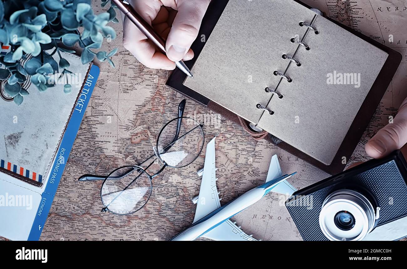 Travel concept. Map on the table and model aircraft Stock Photo - Alamy