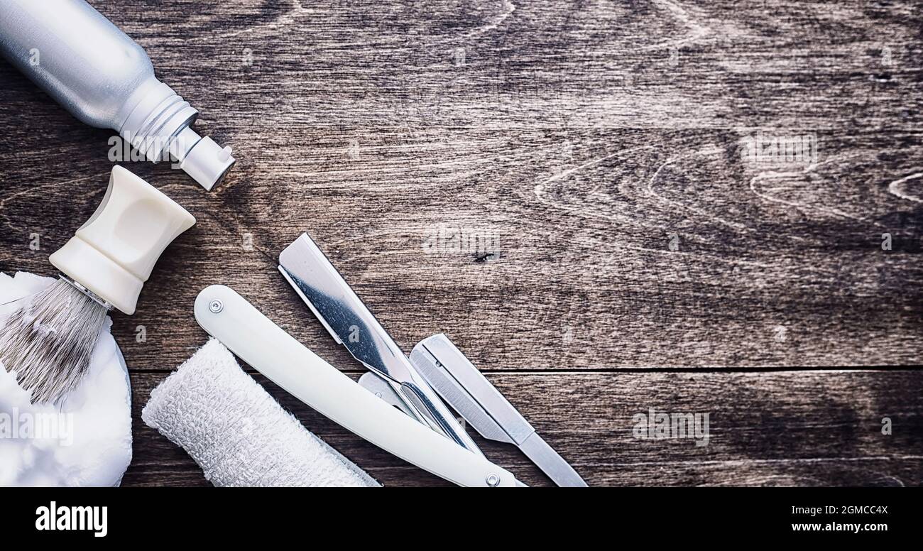 Shaving accessories on a wooden texture background. Tools. Disposable ...