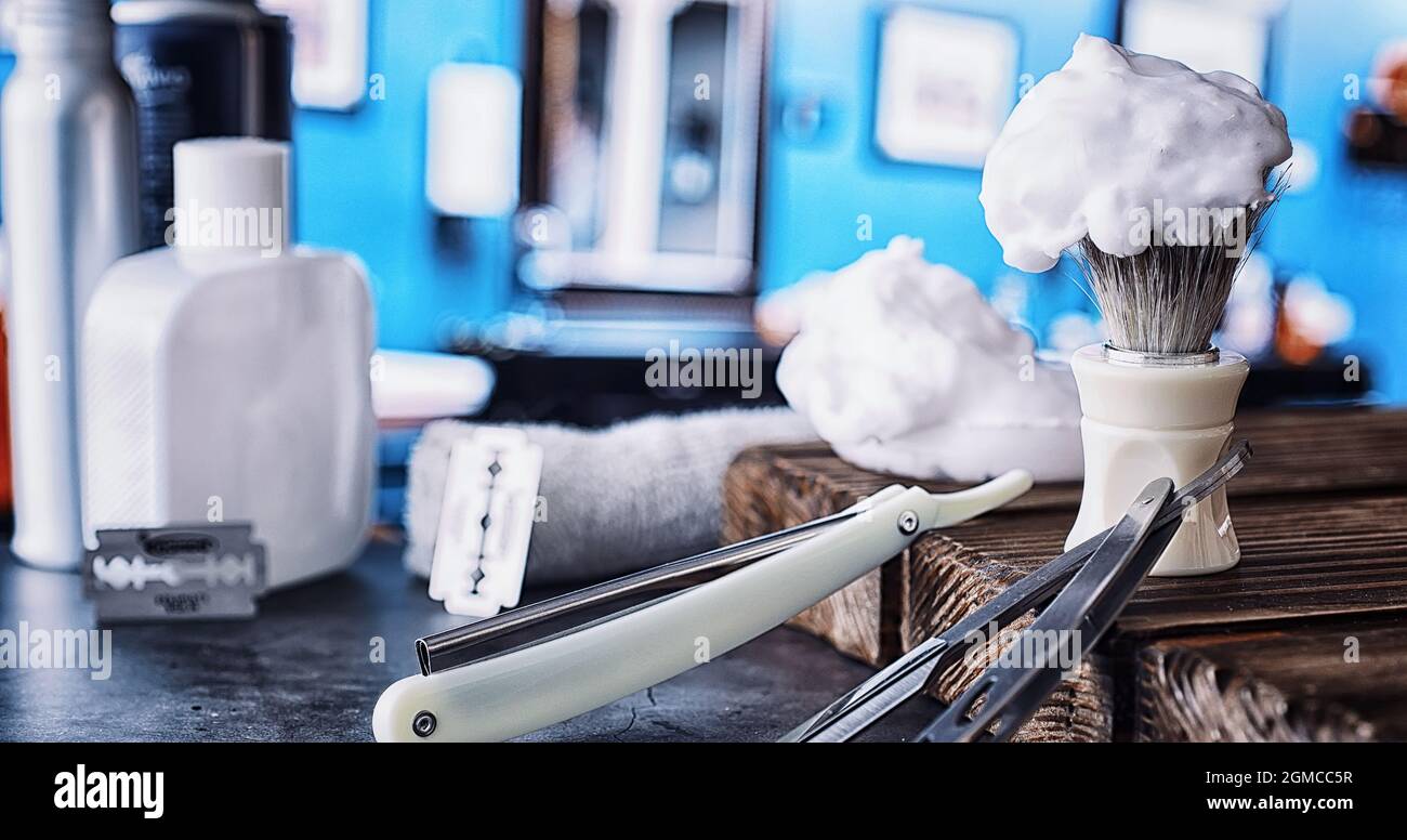 Shaving accessories on a wooden texture background. Tools. Disposable ...