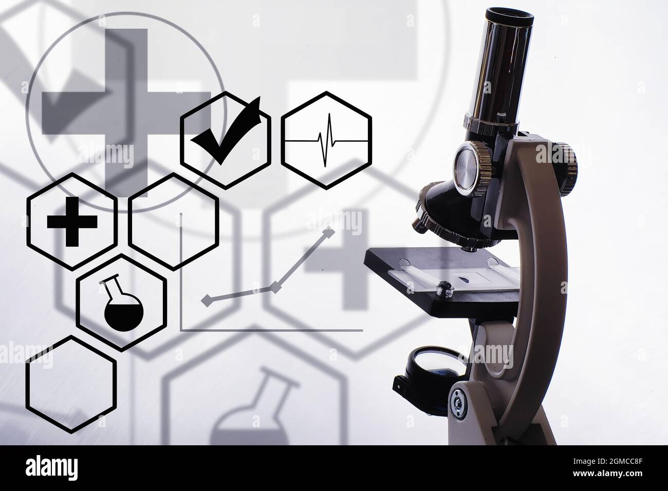 Research laboratory. Test tubes and microscope on the table on a white ...