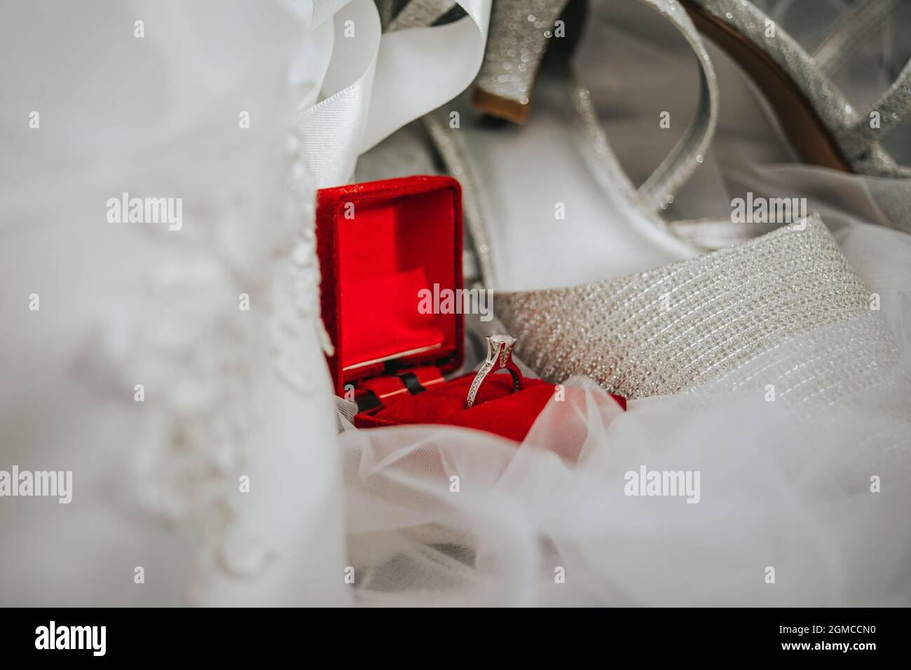 red wedding box and ring on white Stock Photo - Alamy