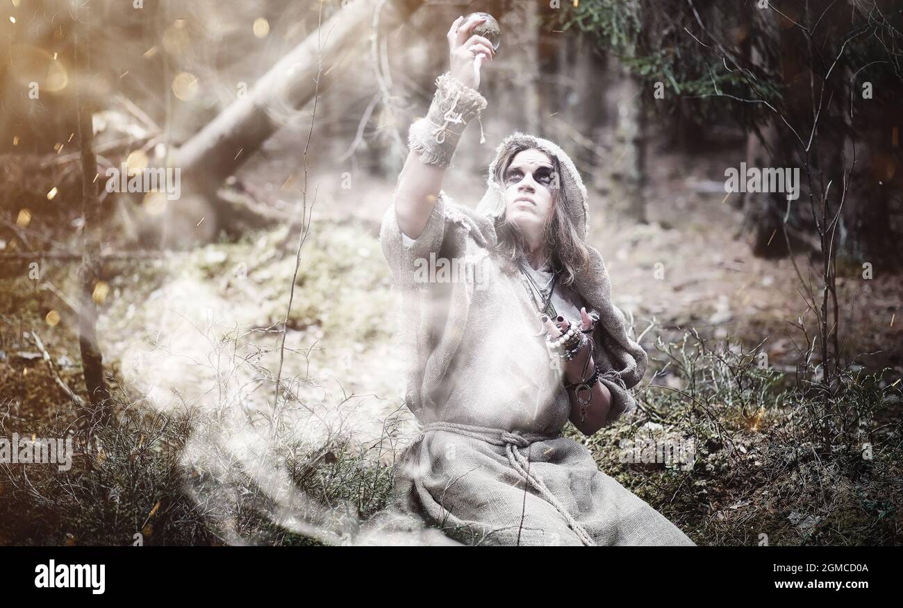 Fairy magician. A sorcerer with a glass sphere, a magical spell and a ...