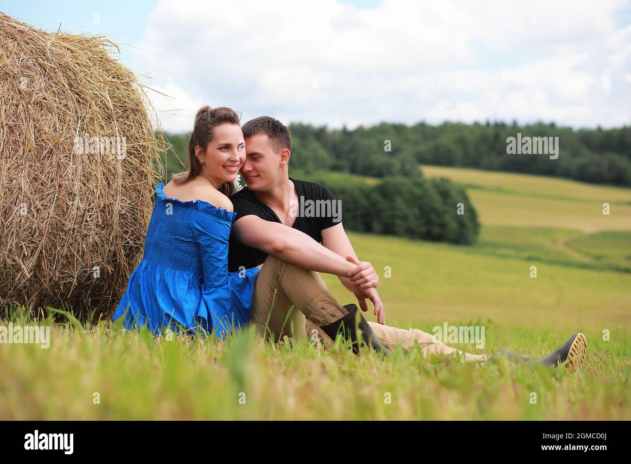 couple in love in a village field at sunset Stock Photo - Alamy