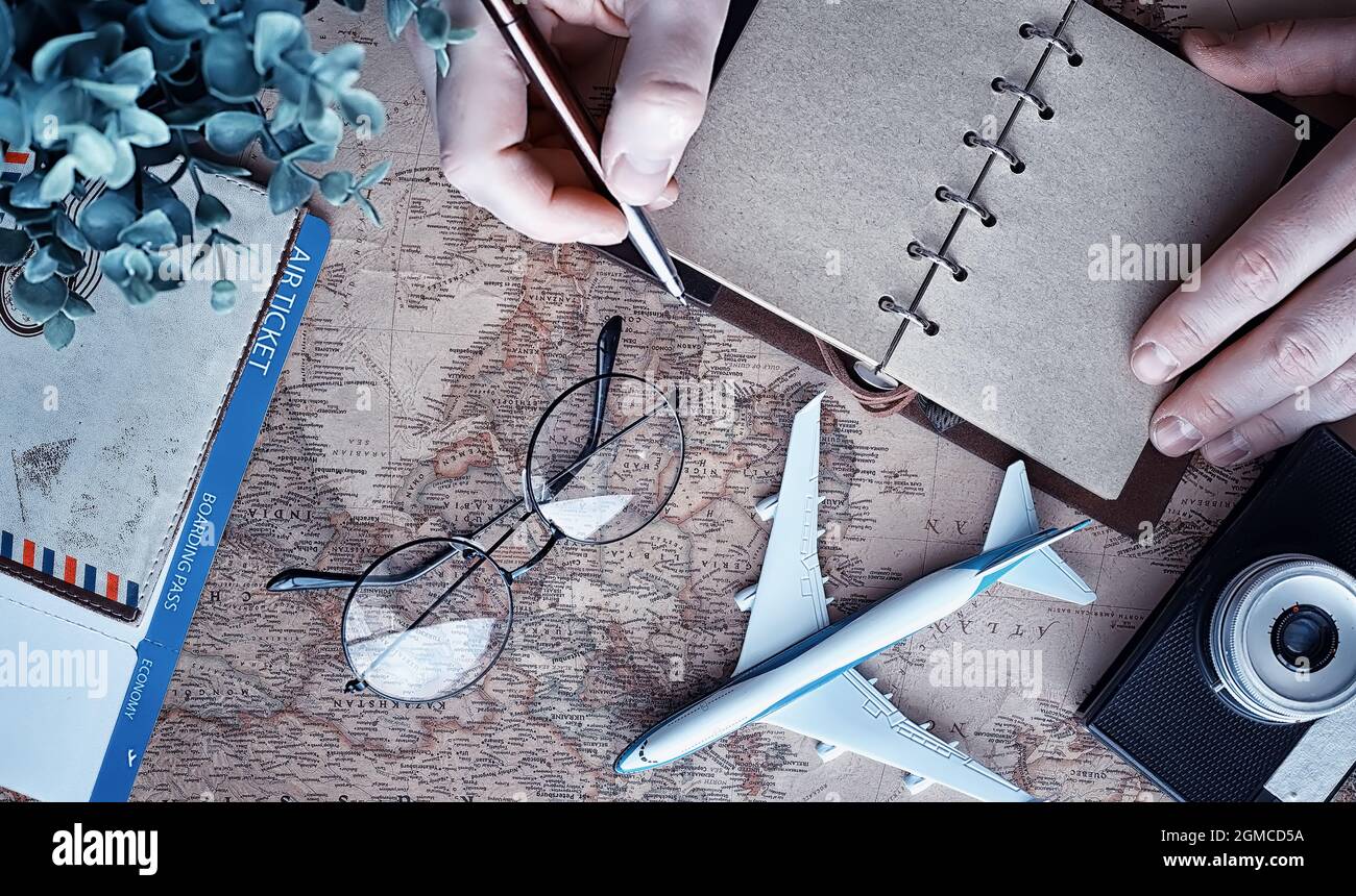 Travel concept. Map on the table and model aircraft Stock Photo - Alamy