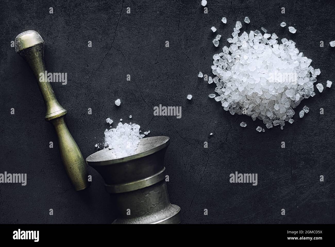Large sea salt. Spice. Mortar and pestle for grinding salt Stock Photo ...