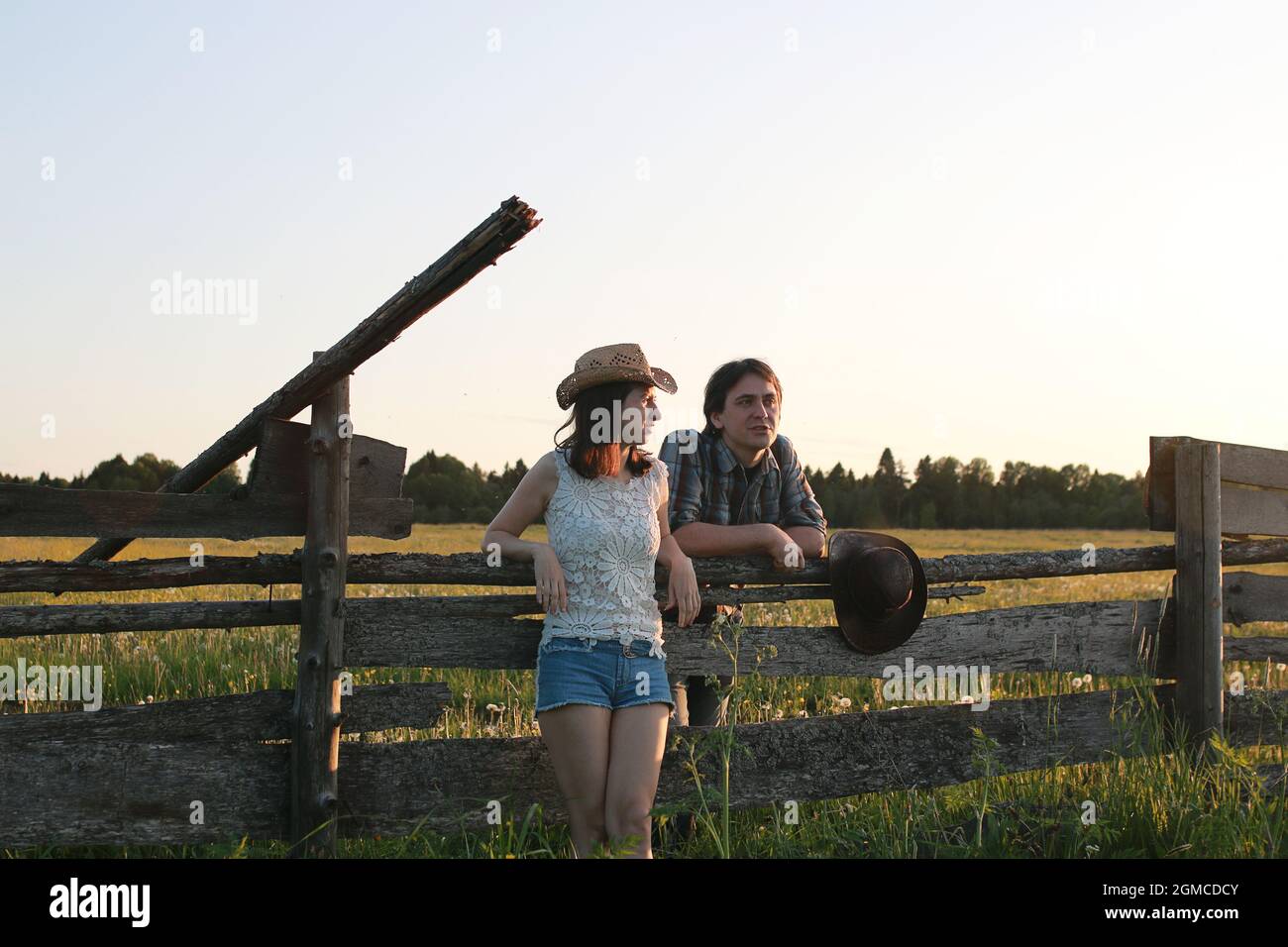 Cute couple on a walk by the countryside summer Stock Photo - Alamy