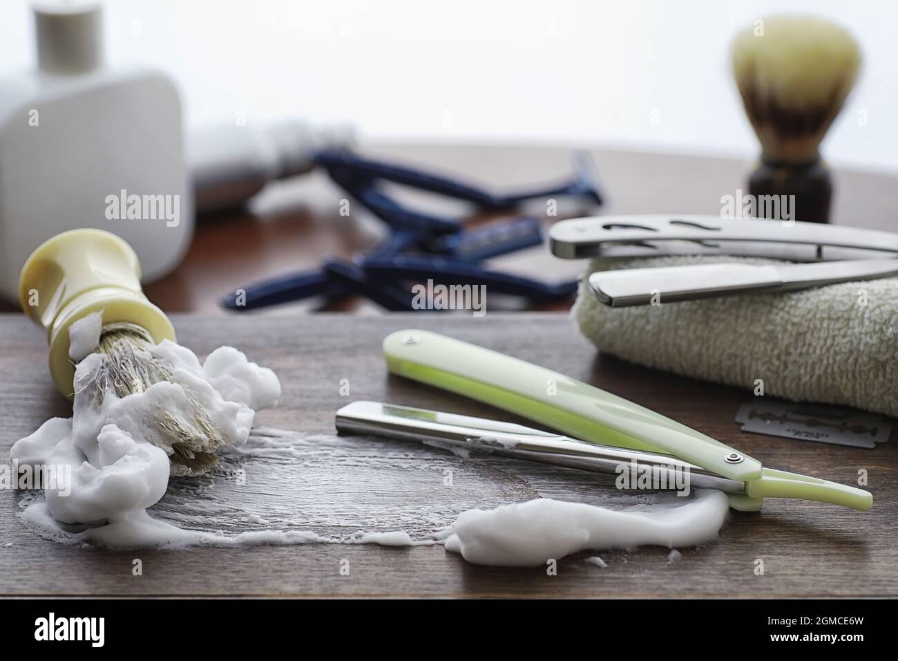 Shaving accessories on a wooden texture background. Tools. Disposable ...