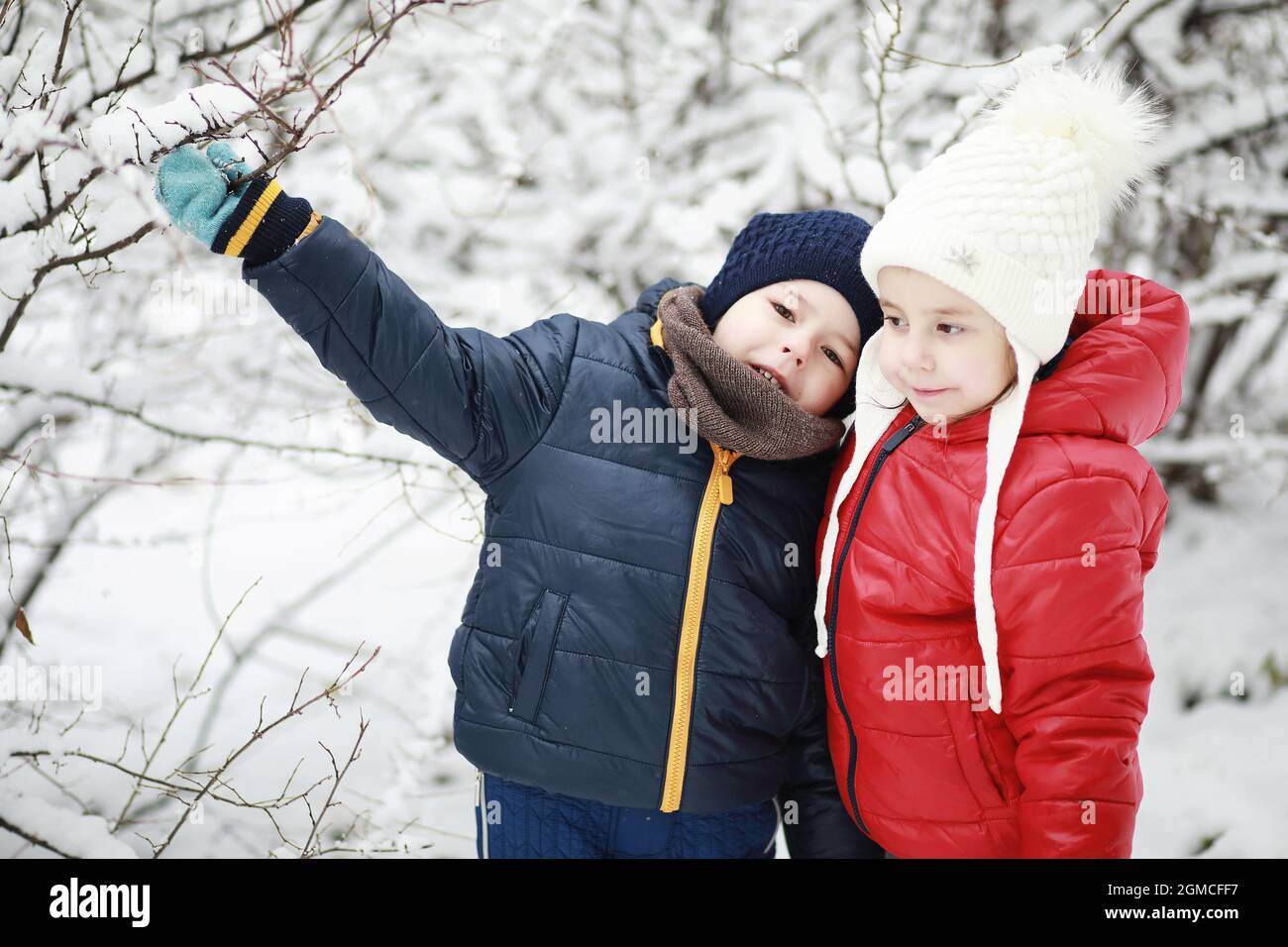 children in winter park play with snow Stock Photo - Alamy