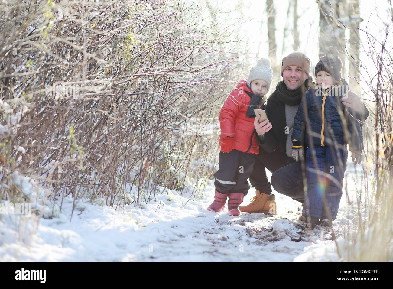 children in winter park play with snow Stock Photo - Alamy