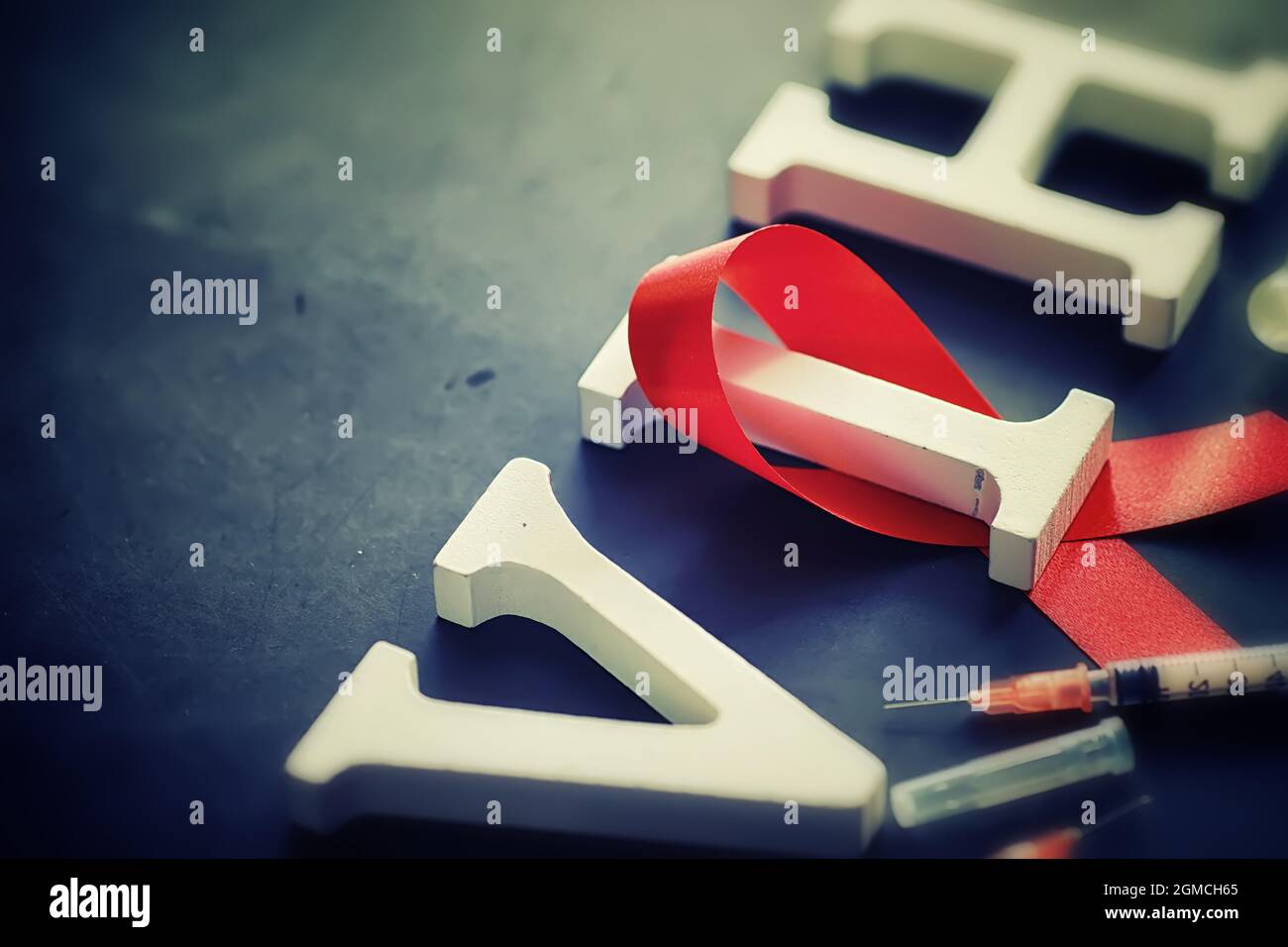 Symbol of human immunodeficiency virus disease. Red ribbon. A helping ...