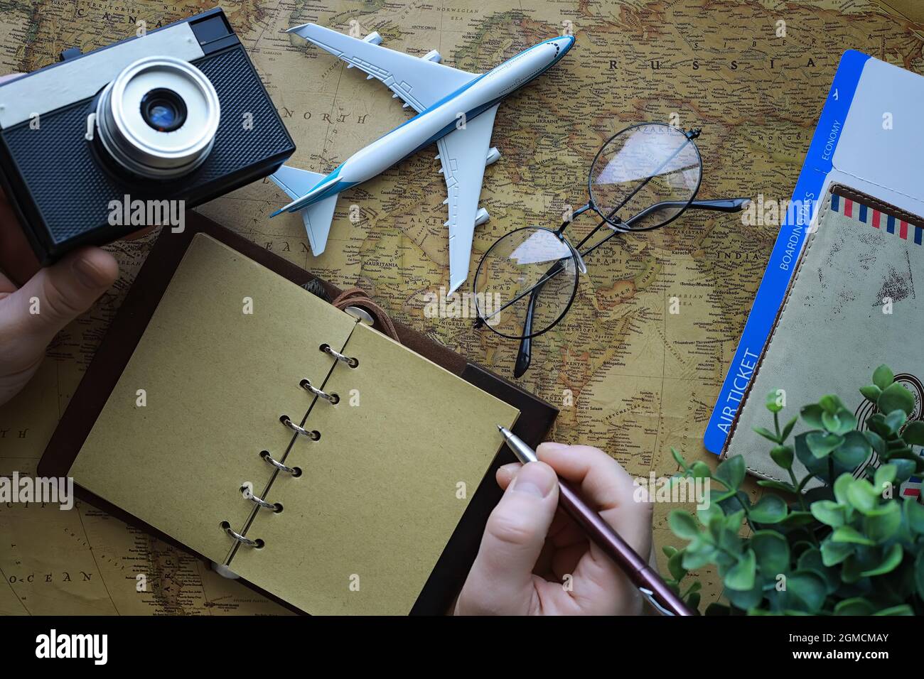 Travel concept. Map on the table and model aircraft Stock Photo - Alamy