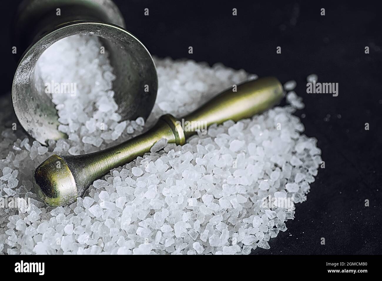 Large sea salt. Spice. Mortar and pestle for grinding salt Stock Photo ...