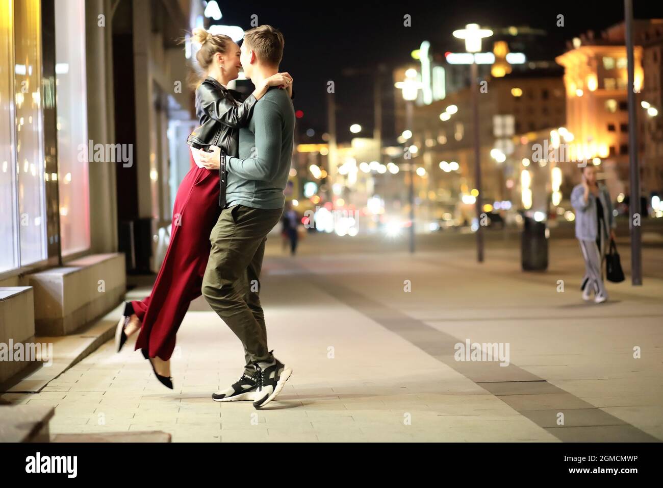 Beautiful couple on a date in a night city outdoor Stock Photo - Alamy