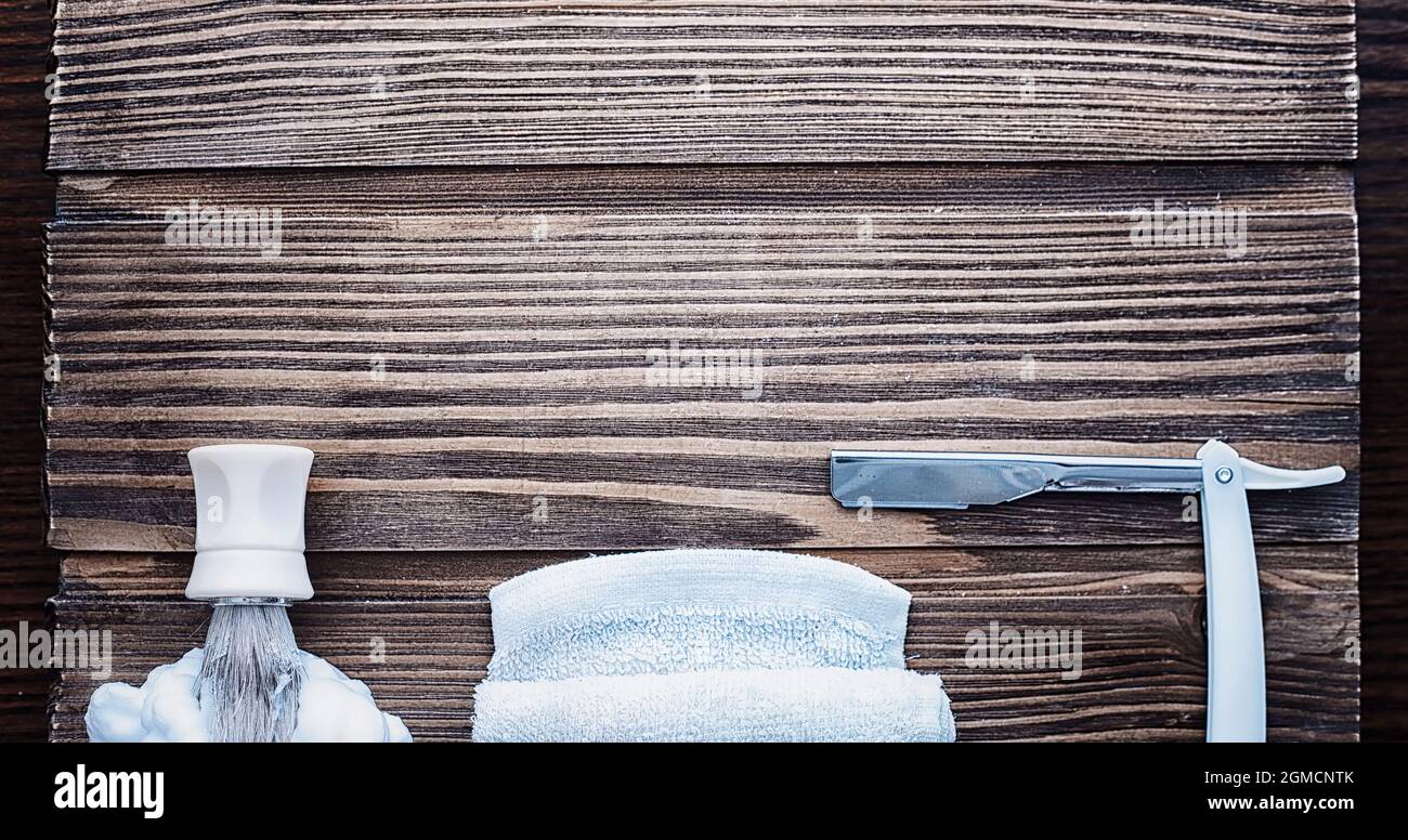 Shaving accessories on a wooden texture background. Tools. Disposable ...