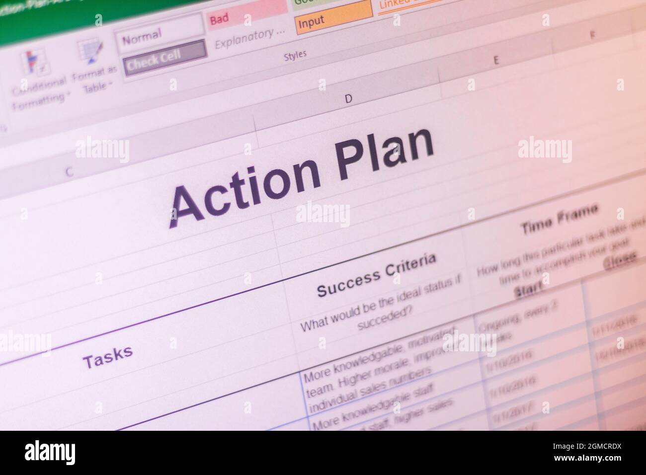 Shot of an excel sheet on computer screen showing business action plan ...