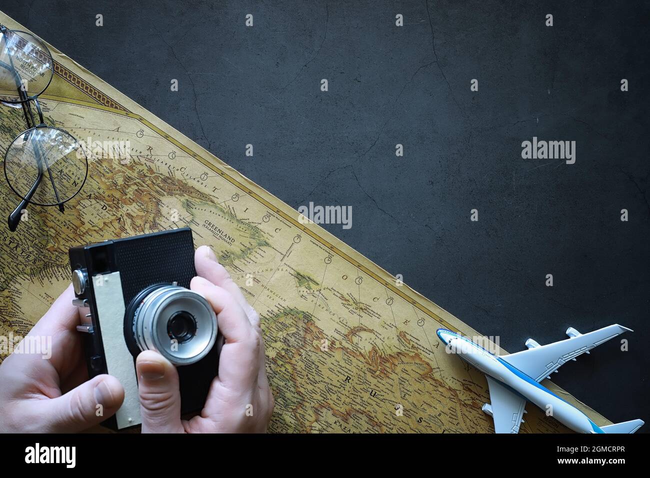 Travel concept. Map on the table and model aircraft Stock Photo - Alamy