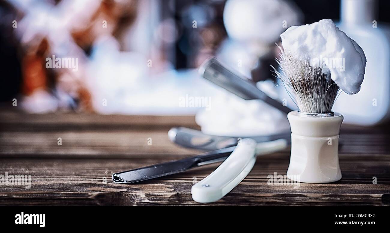 Shaving accessories on a wooden texture background. Tools. Disposable ...