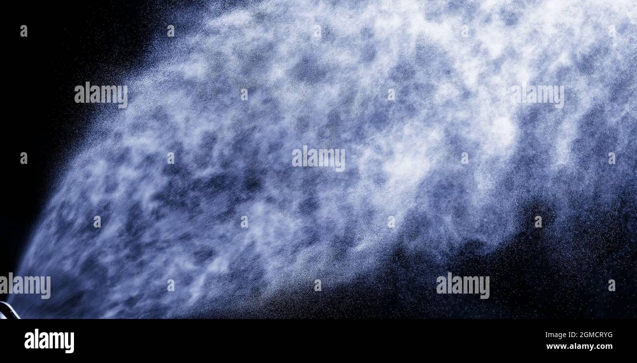 A stream of water and a cloud of drops from the atomizer Stock Photo ...