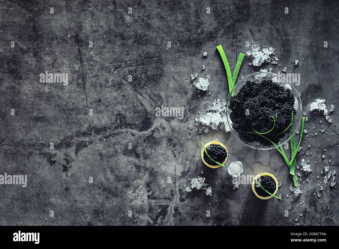 Fresh black fish roe. Beluga caviar served with ice with green Stock ...
