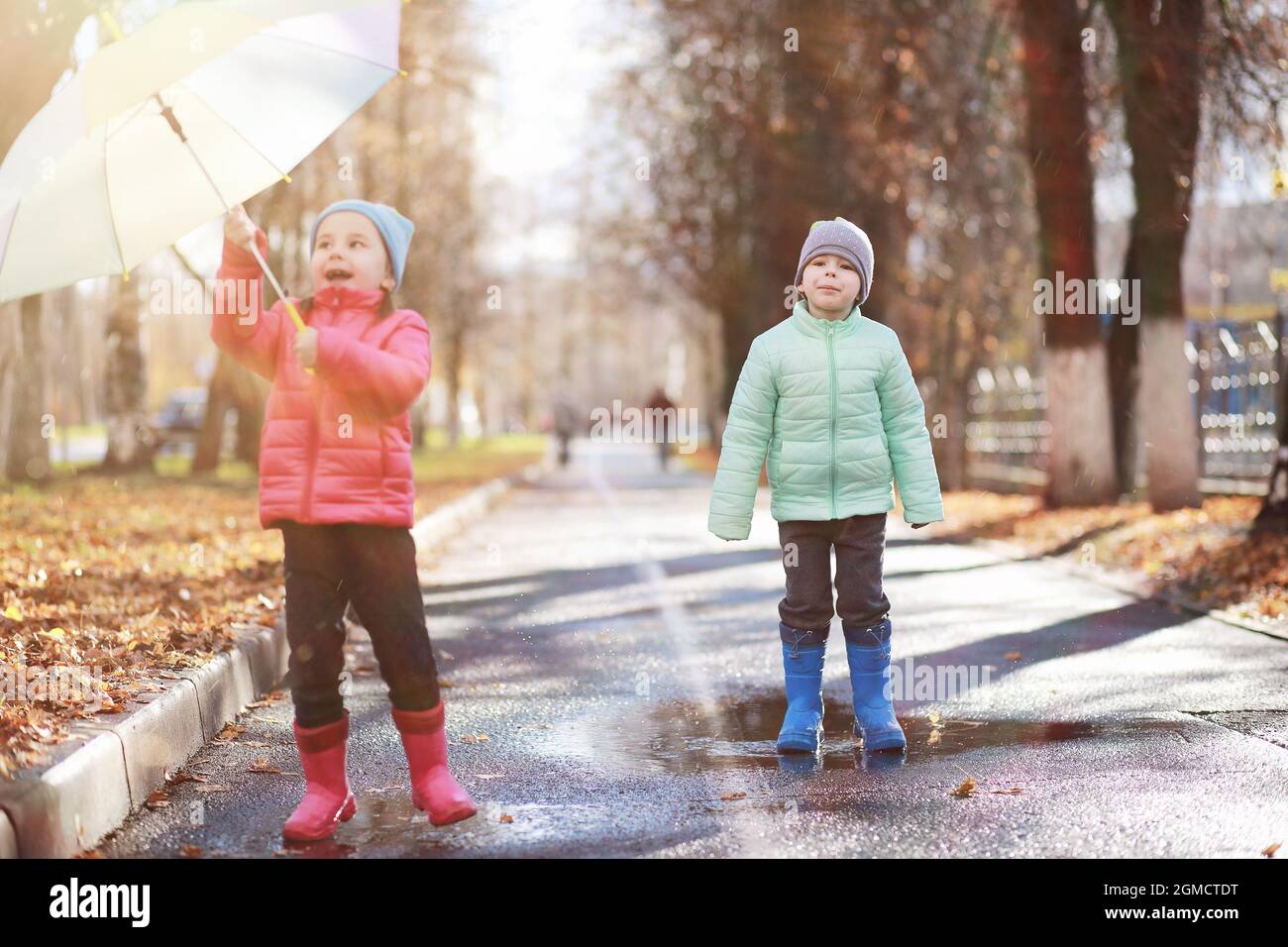 Children walk in the autumn park in the fall Stock Photo - Alamy
