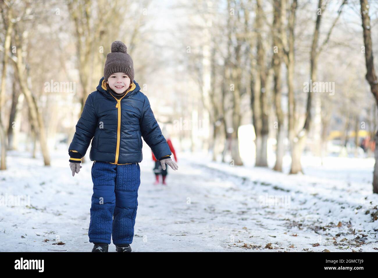 children in winter park play with snow Stock Photo - Alamy