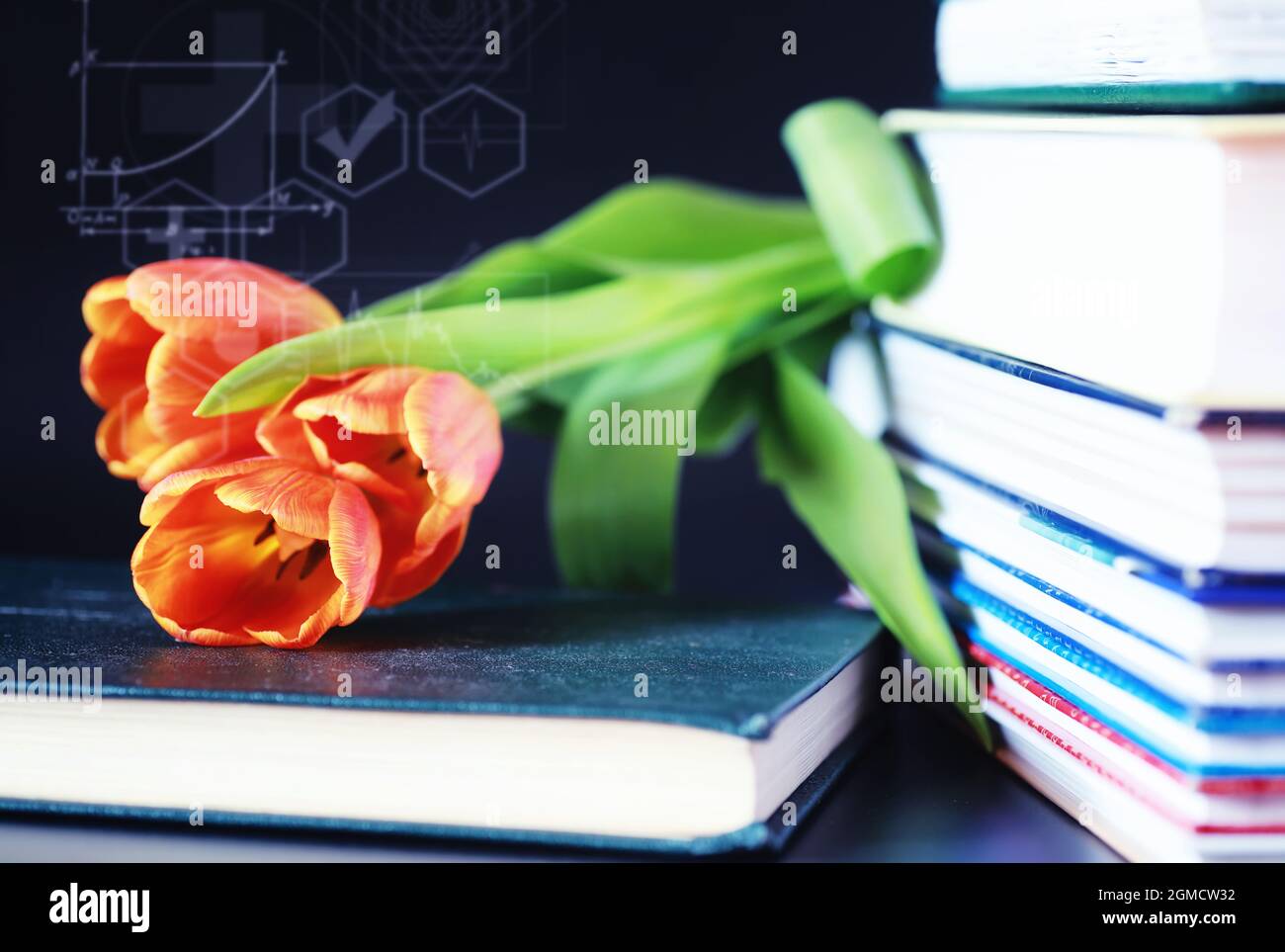 A stack of textbooks and books on table. The concept of knowledge and ...
