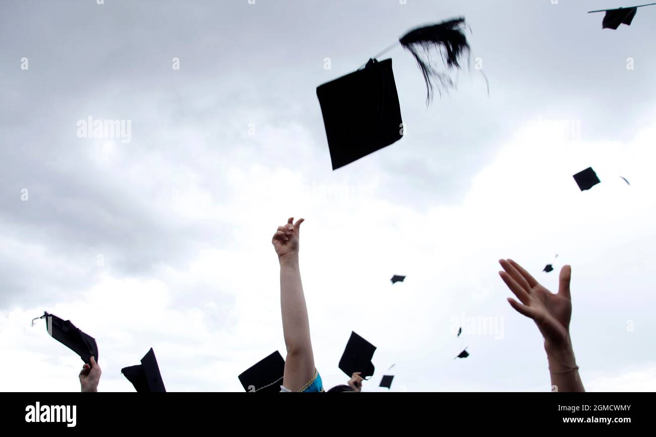 University graduation ceremony, caps flying in the air Stock Photo - Alamy