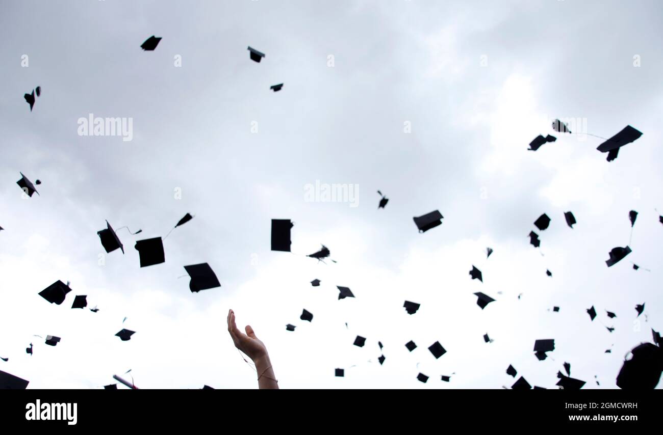 University graduation ceremony, caps flying in the air Stock Photo - Alamy