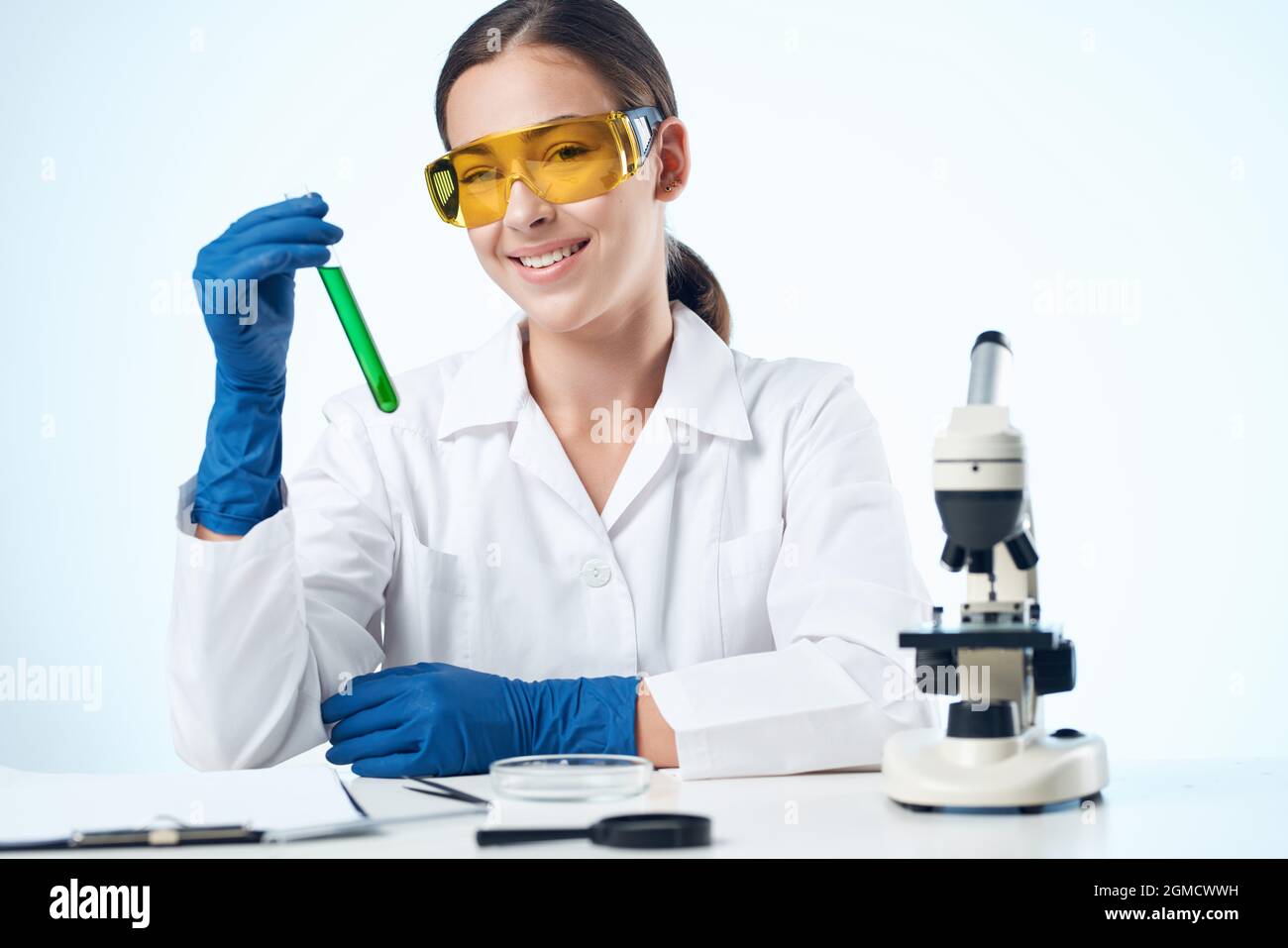 woman biologist laboratory research chemical solution microscope Stock ...