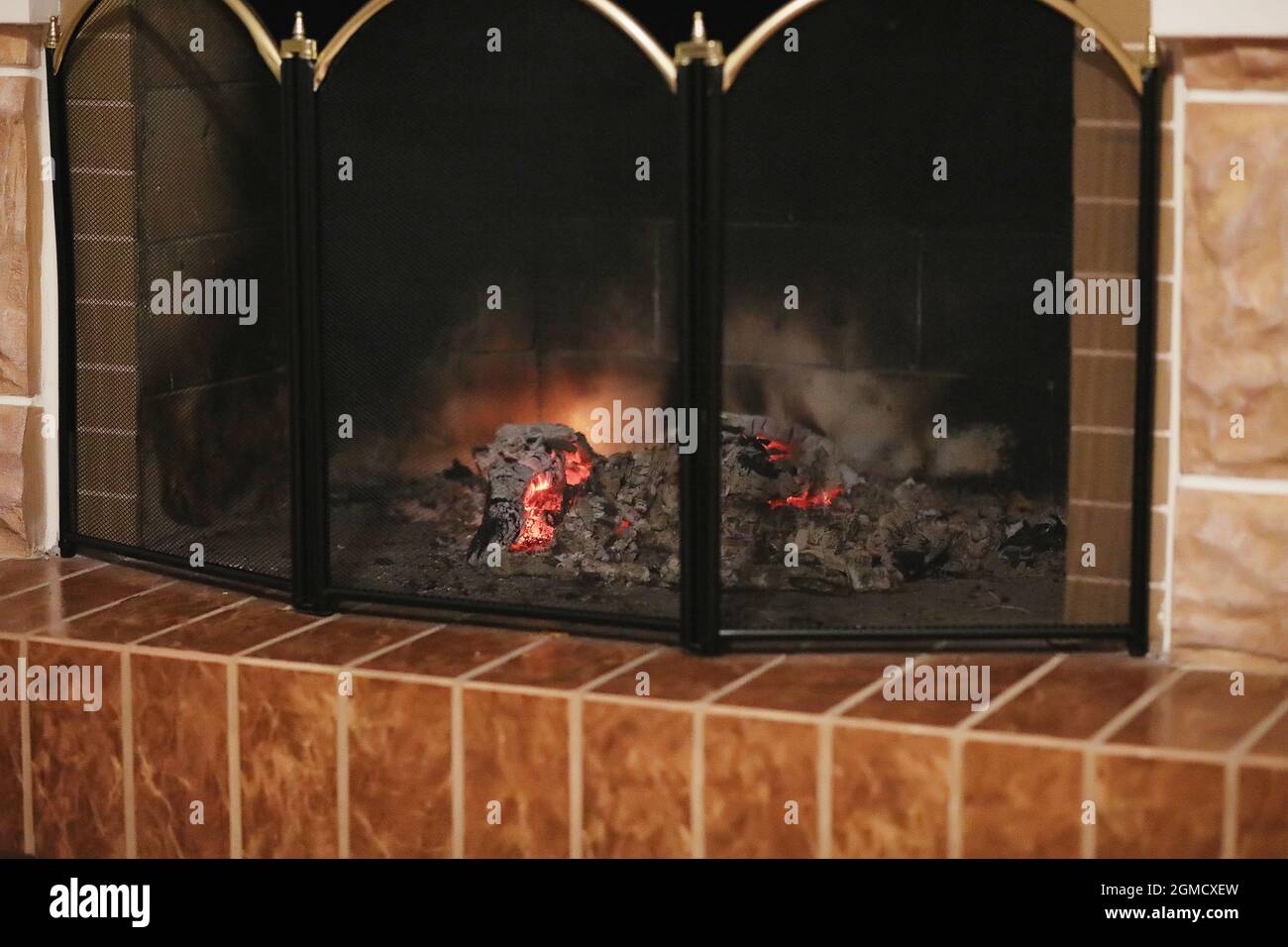 Fire burns in the home fireplace Stock Photo - Alamy